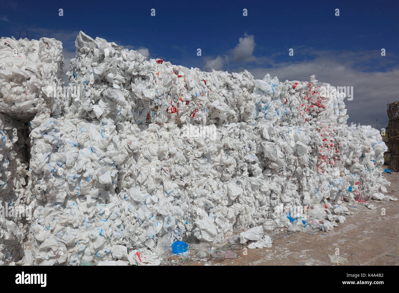 Bales with kind-pure plastic rubbish, foils, in a recycling company ...