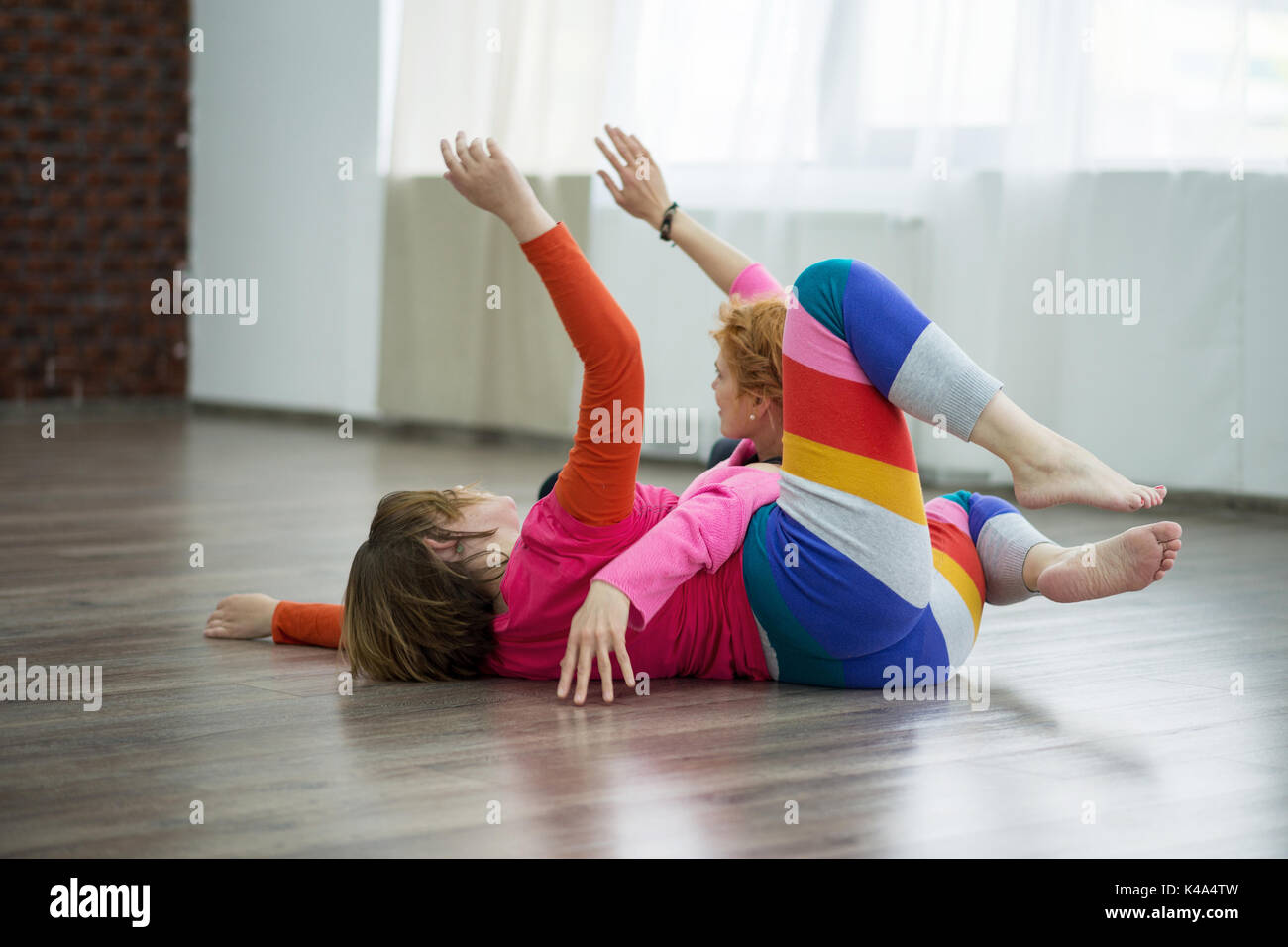 Two women dancing dance contact improvisation Stock Photo - Alamy