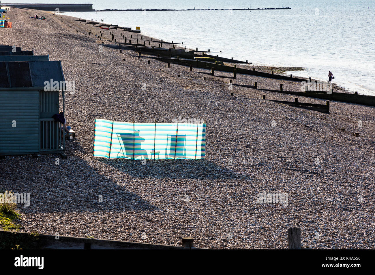 Family beach wind break hi-res stock photography and images - Alamy