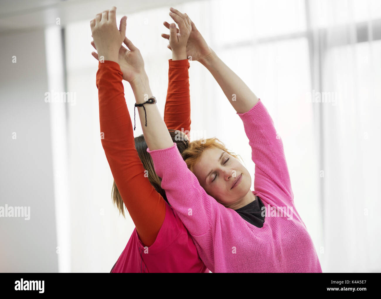 Two women dancing dance contact improvisation Stock Photo - Alamy