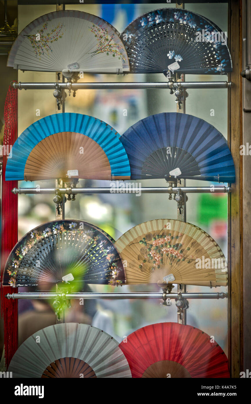 Decorative traditional Spanish fans displayed in a store window in ...