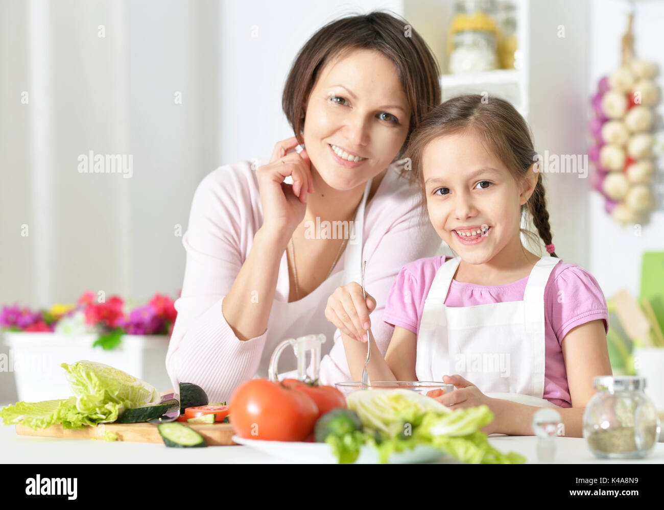 Mother and daughter cooking together Stock Photo - Alamy