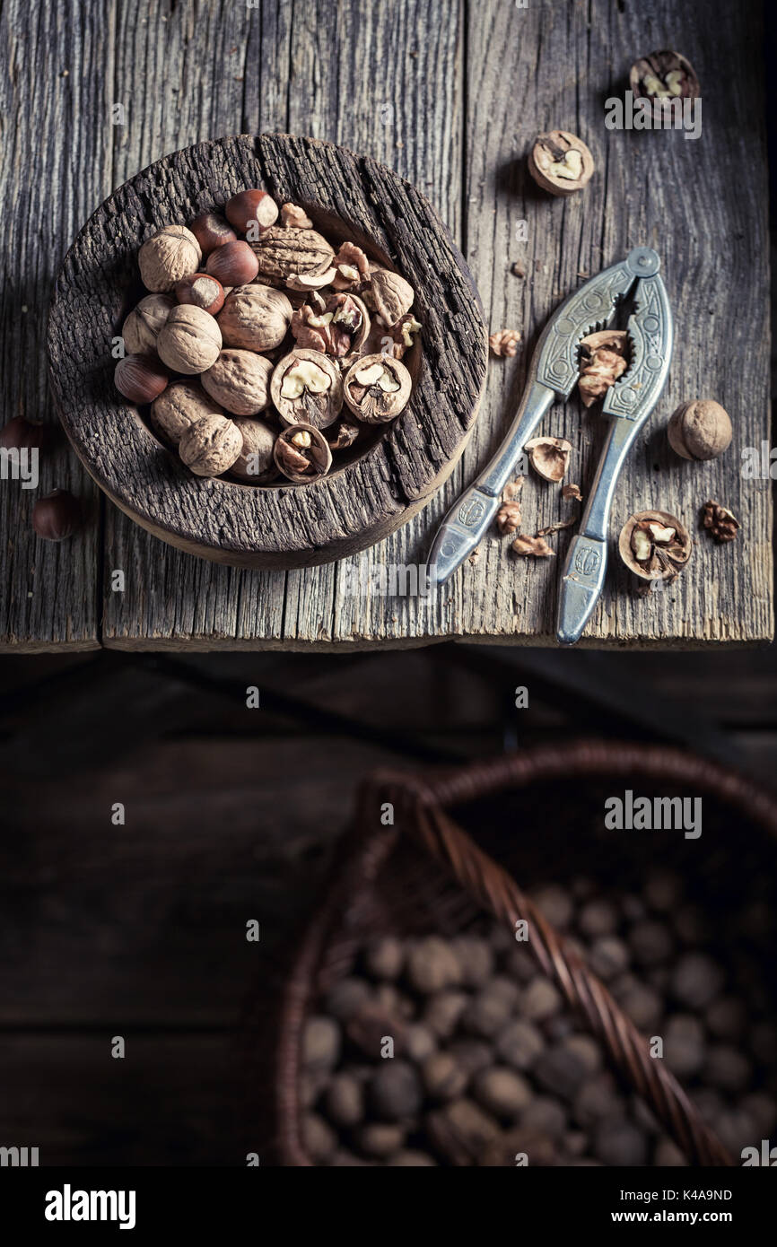 Tasty various nuts with with old nutcracker Stock Photo - Alamy