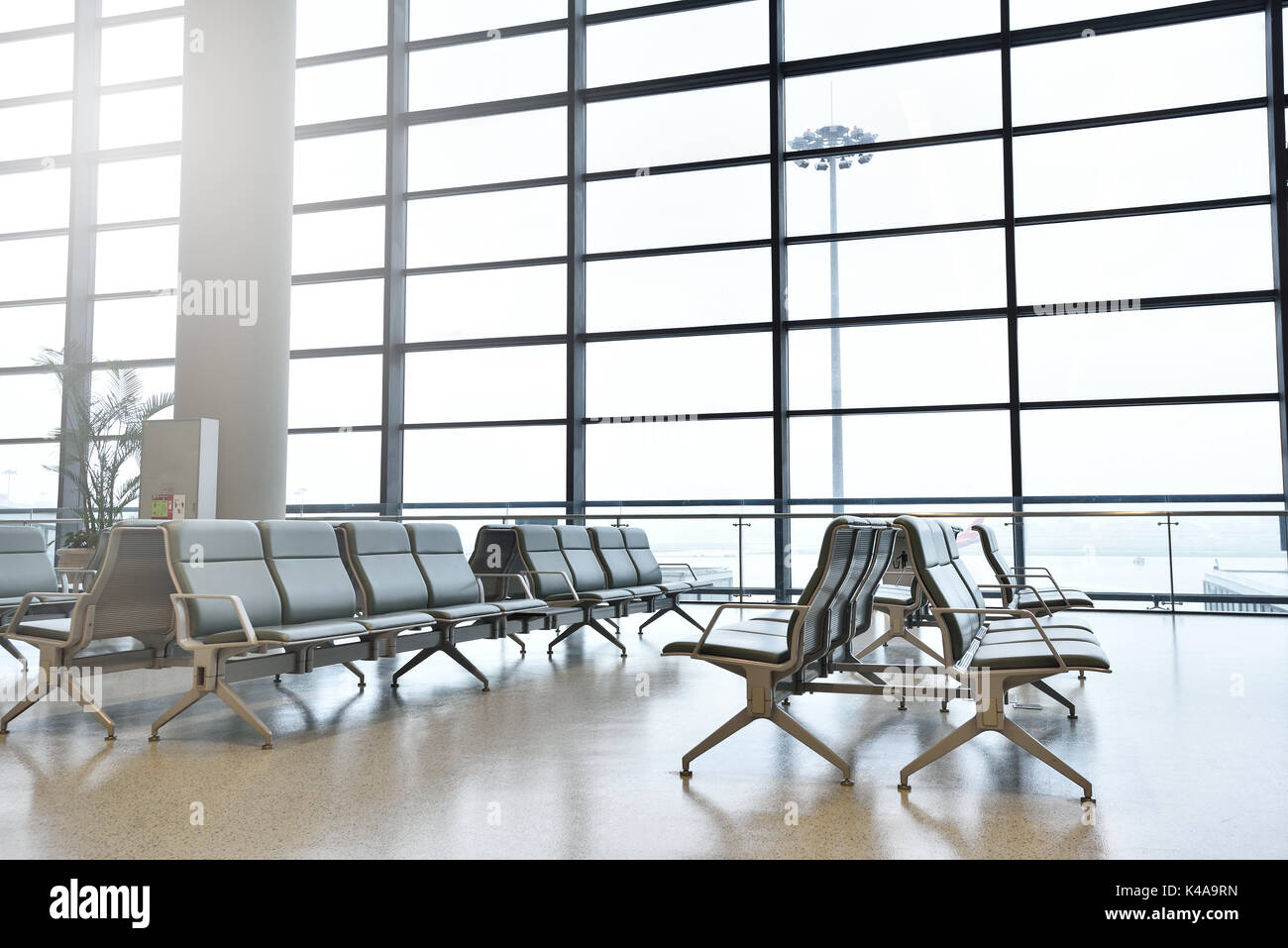 Empty airport terminal waiting area with chairs Stock Photo - Alamy