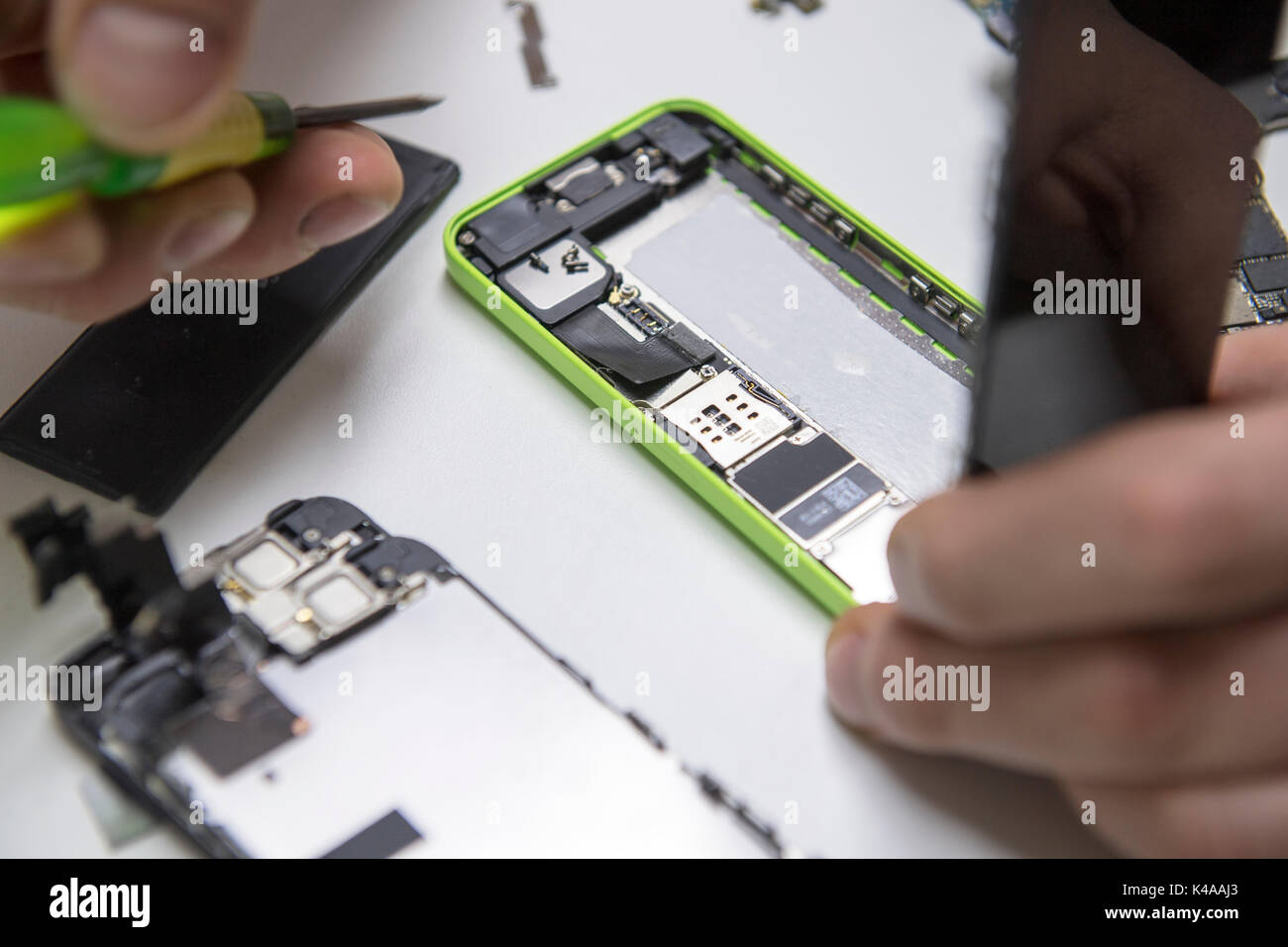 someone repairing a cell phone Stock Photo - Alamy