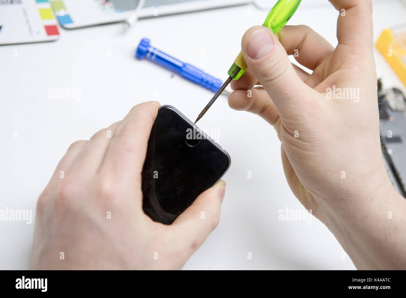 someone repairing a cell phone Stock Photo - Alamy