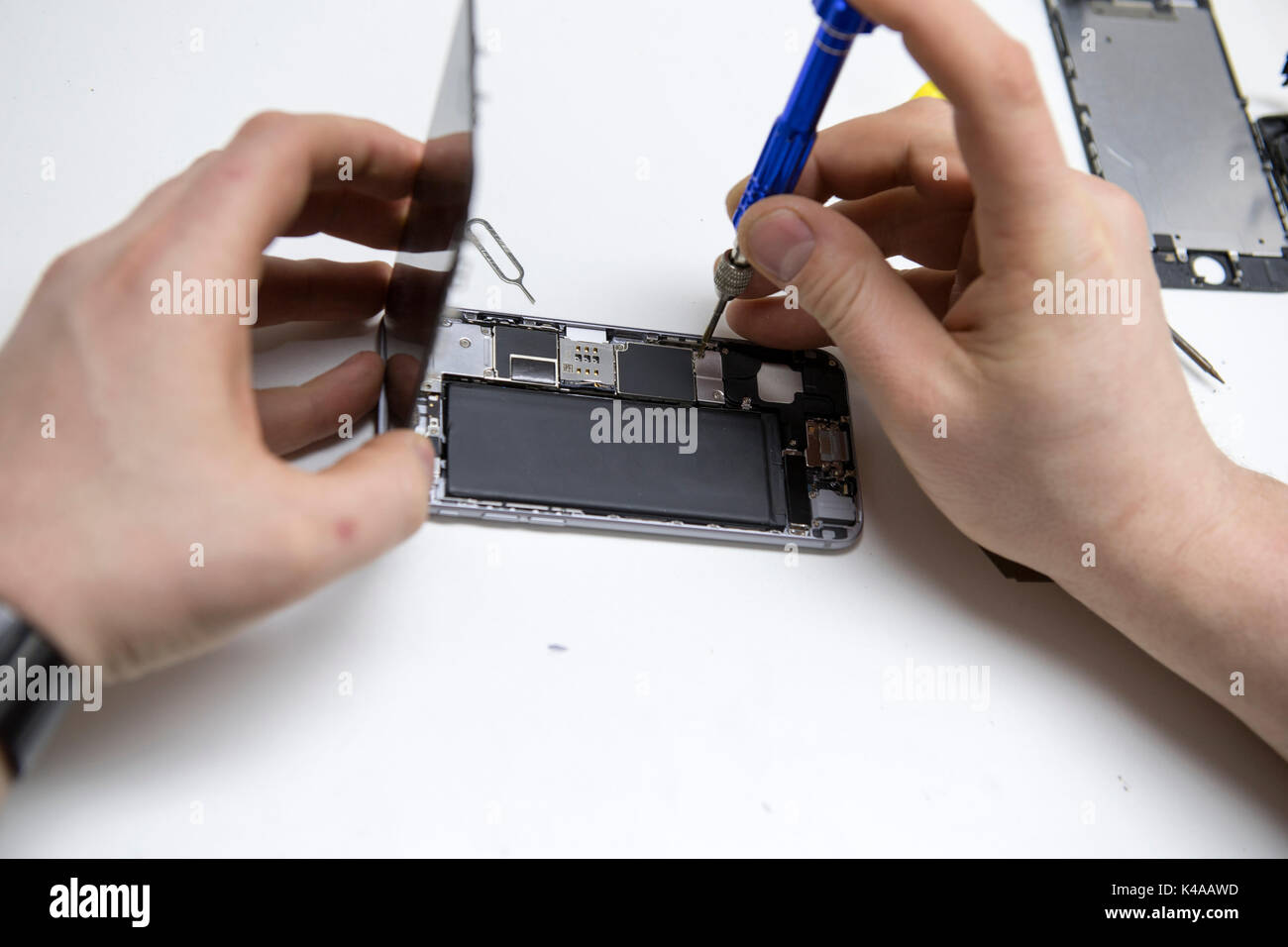 Fixing a telephone hi-res stock photography and images - Alamy