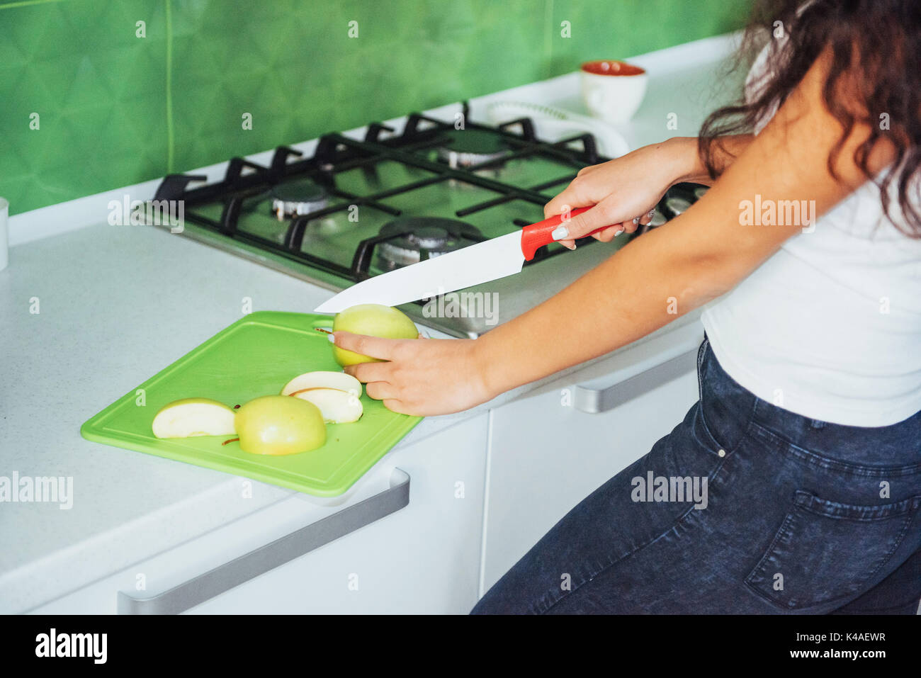 Happy woman dicing food hi-res stock photography and images - Alamy