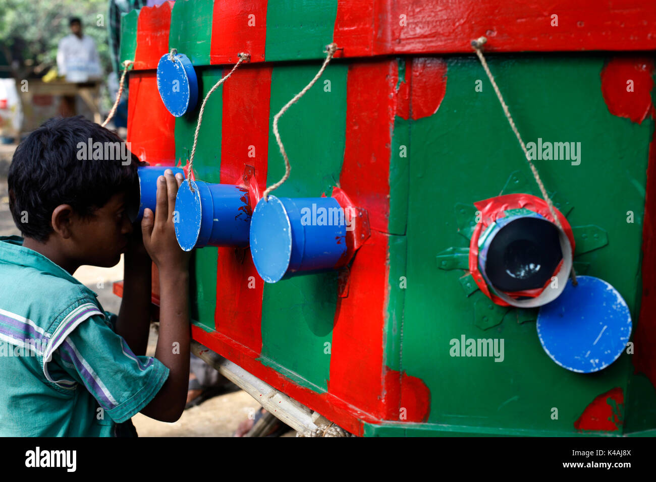 City dwellers watching still Movies or traditional bioscope during the ...