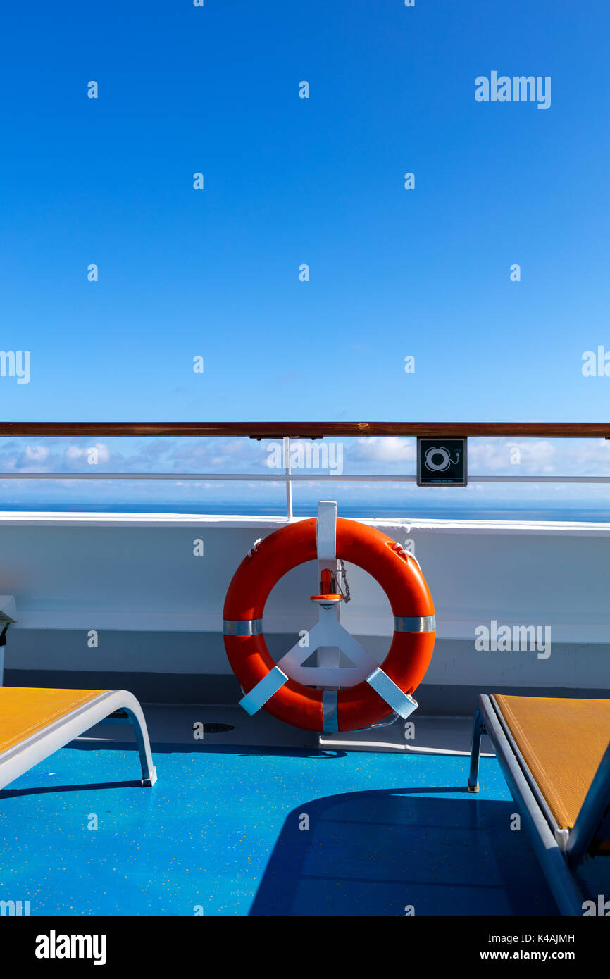orange lifeguard on the edge of an ocean liner Stock Photo - Alamy