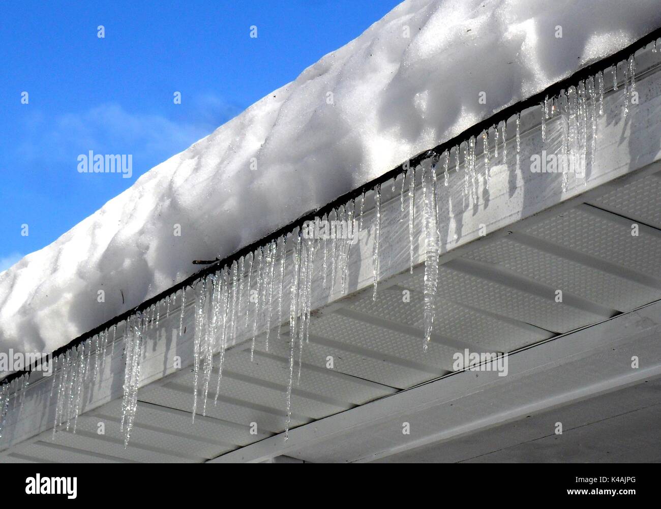 Icicles on a roof edge in Muskoka, Canada Stock Photo - Alamy
