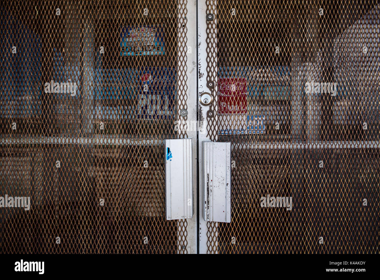 Old closed run down shop and locked door with wire front in Utah, USA ...