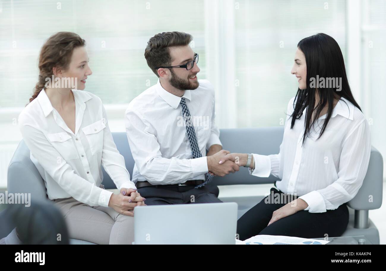 handshake of manager and client in the office lobby Stock Photo - Alamy
