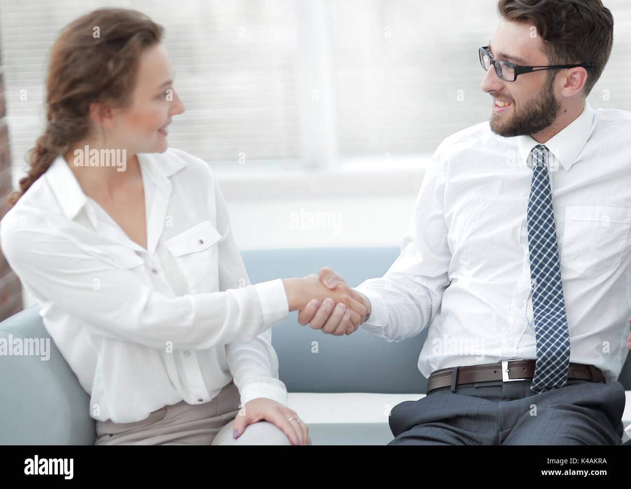 handshake of manager and client in the office lobby Stock Photo - Alamy
