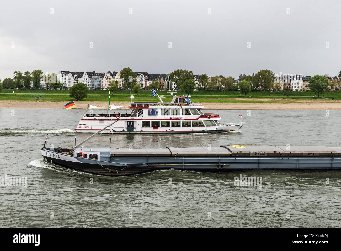 Dusseldorf, Germany - April 16, 2017: Merchant ship and cruise ship ...