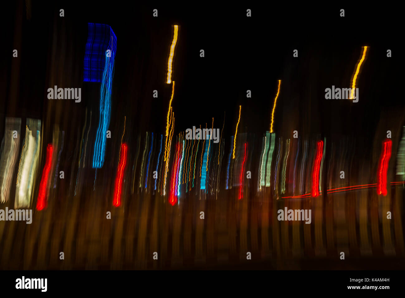 Colored lights in motion at night on street as abstract background ...