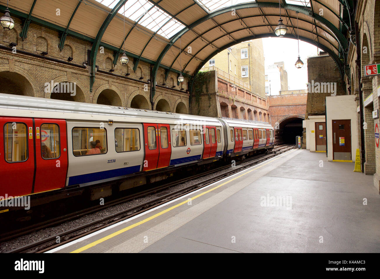 Circle Line train at Notting Hill Gate Underground station in London ...