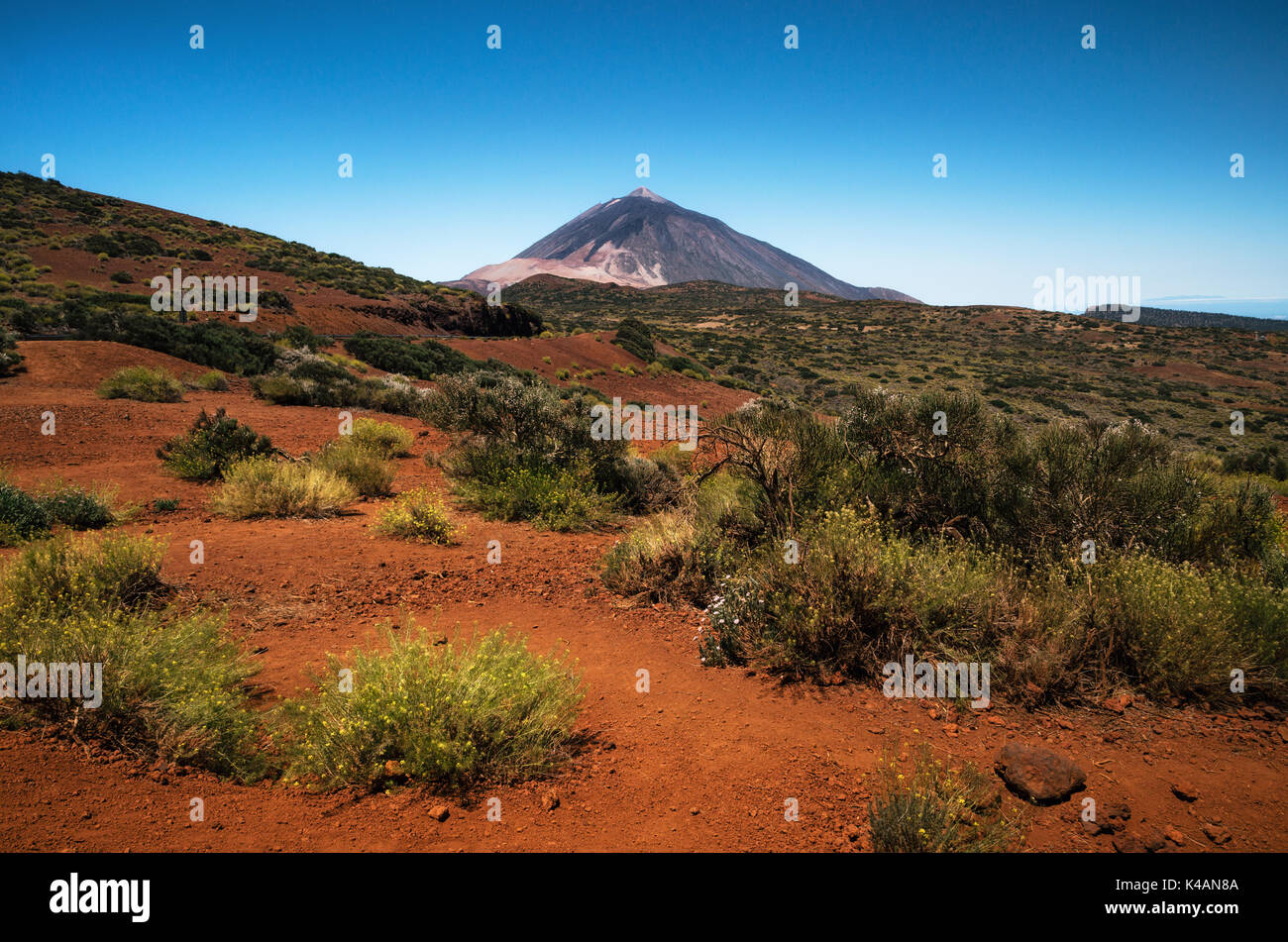 Scenic landscape with the volcano mount and red sand desert of the ...