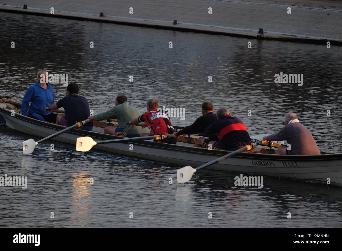 six man cutter boat rowers and cox Stock Photo - Alamy