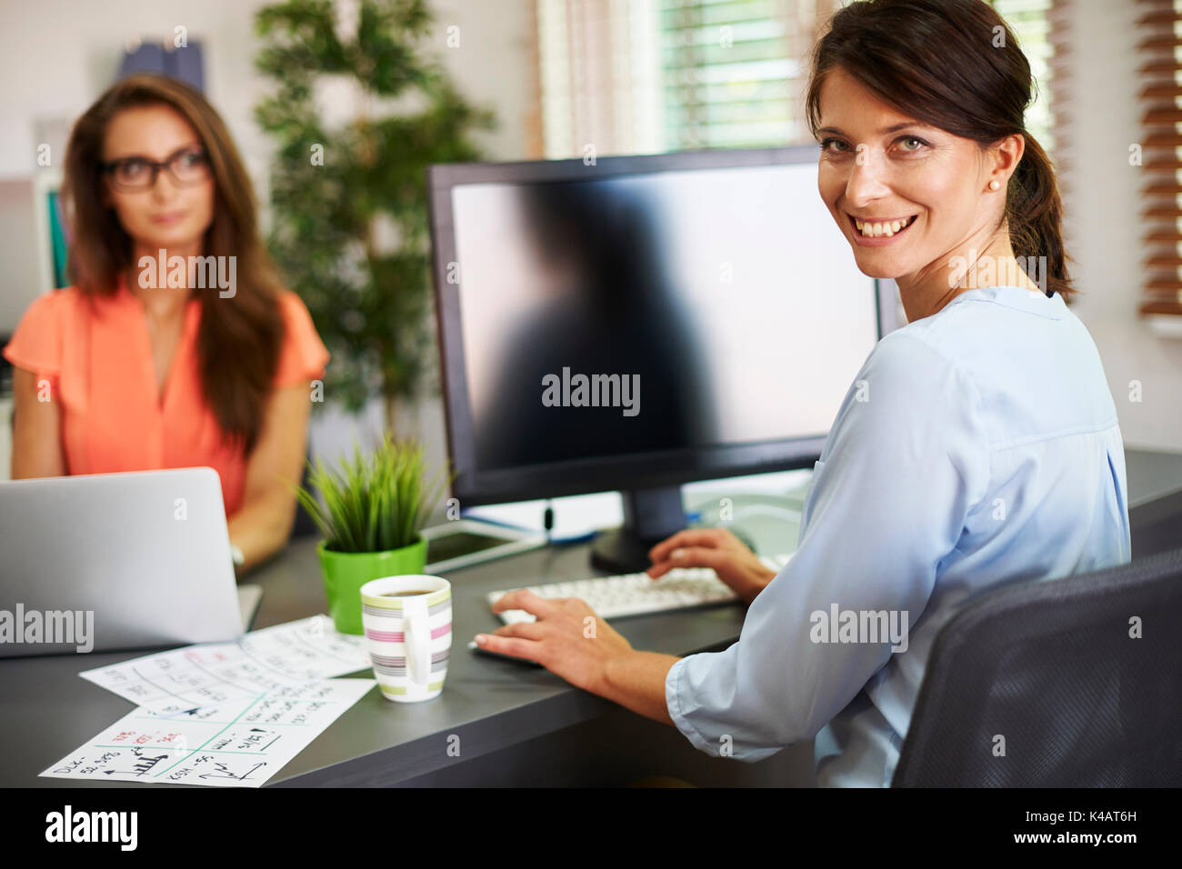 We always work together in the office Stock Photo - Alamy