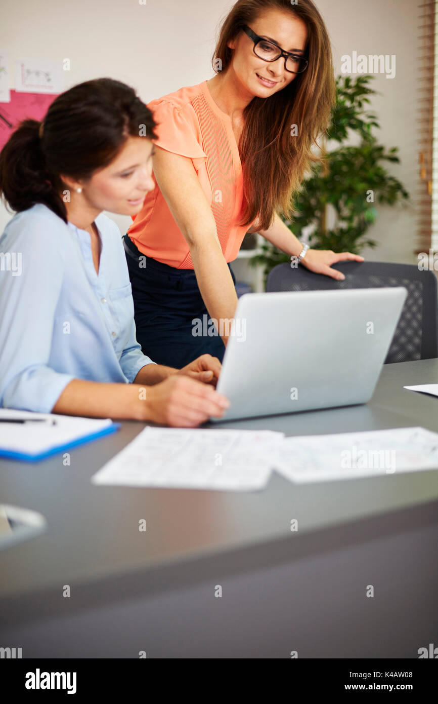 Business help from coworker in corporation Stock Photo - Alamy