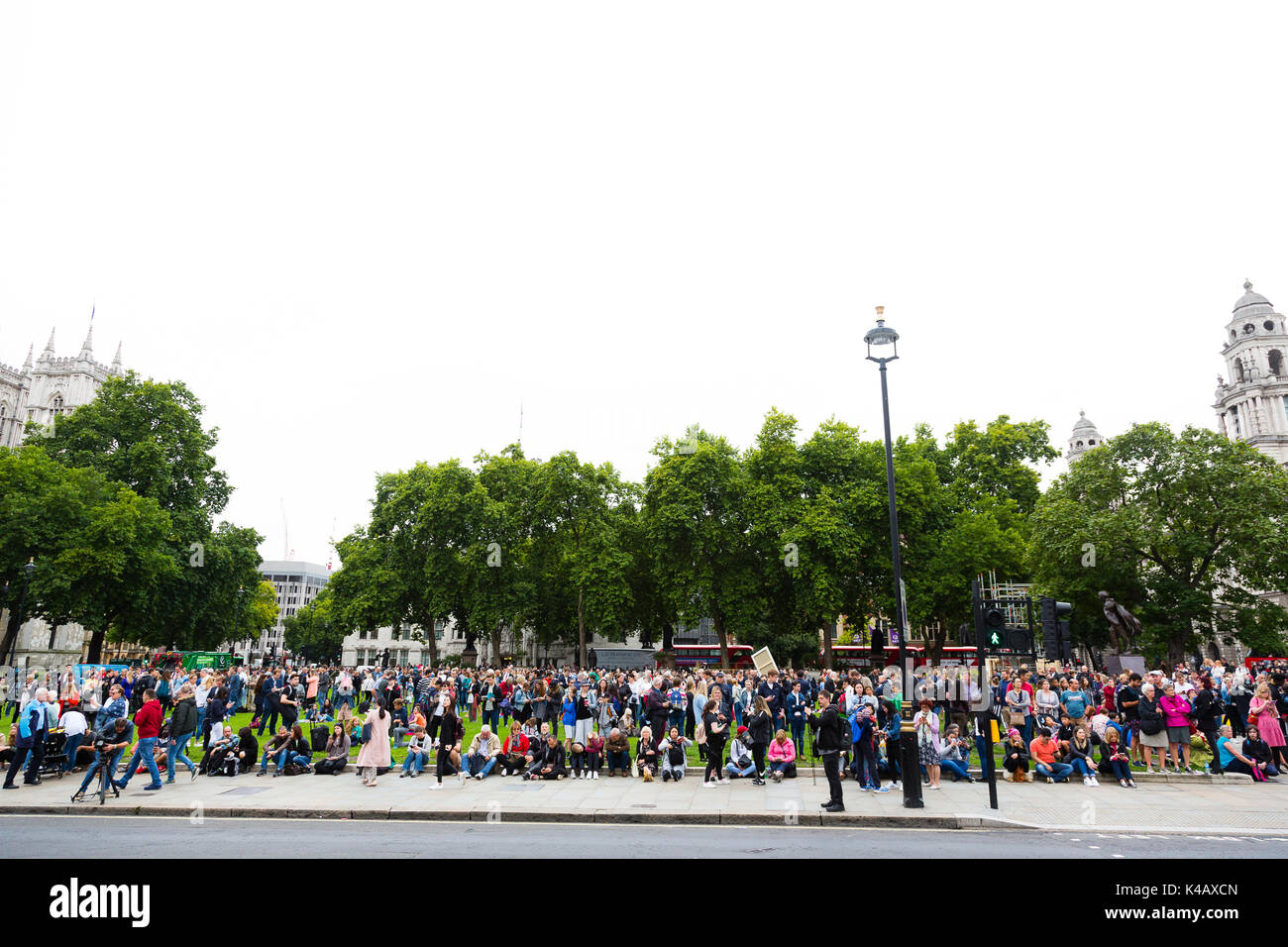London, UK. Crowds gather to watch and listen to Big Ben fall silent ...