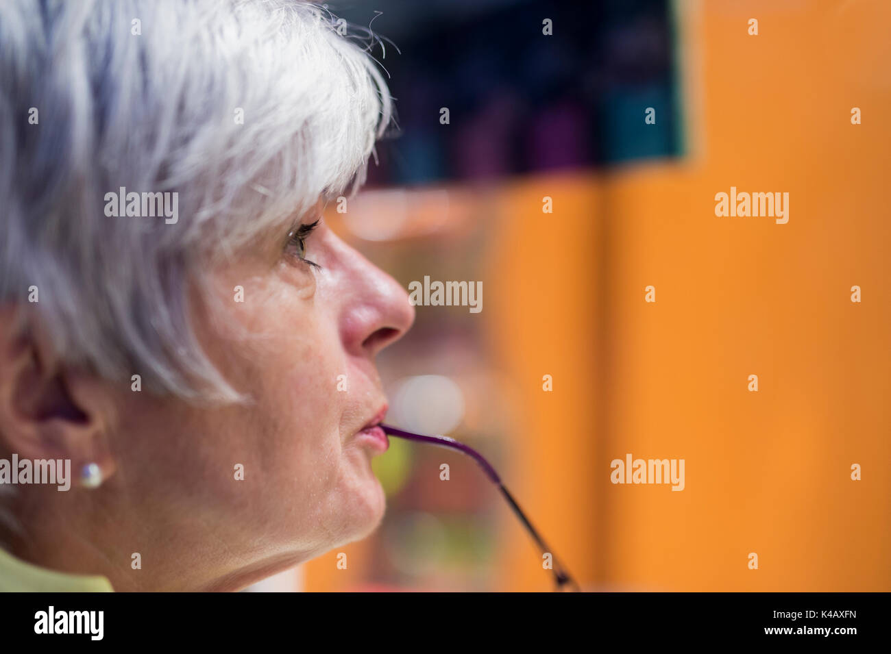 Senior With Attentive Look And Temples In The Mouth Stock Photo - Alamy
