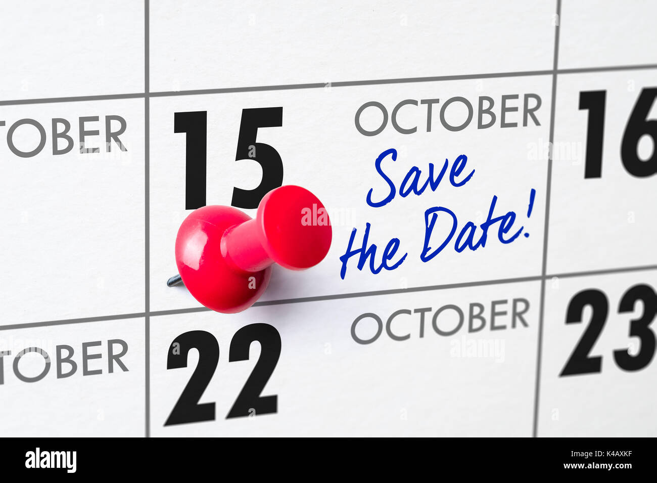 Wall calendar with a red pin - October 15 Stock Photo - Alamy