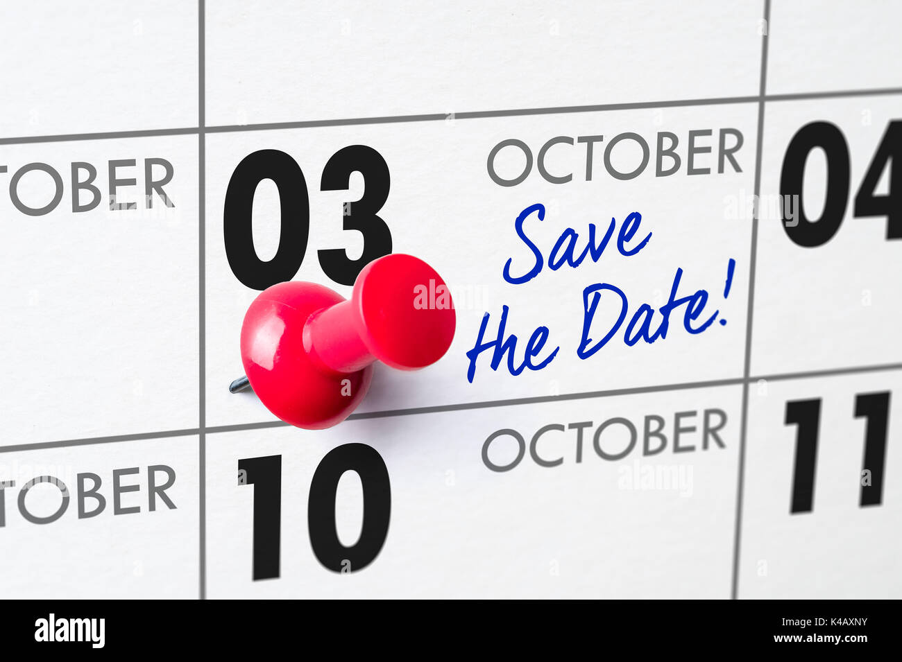 Wall calendar with a red pin - October 03 Stock Photo - Alamy