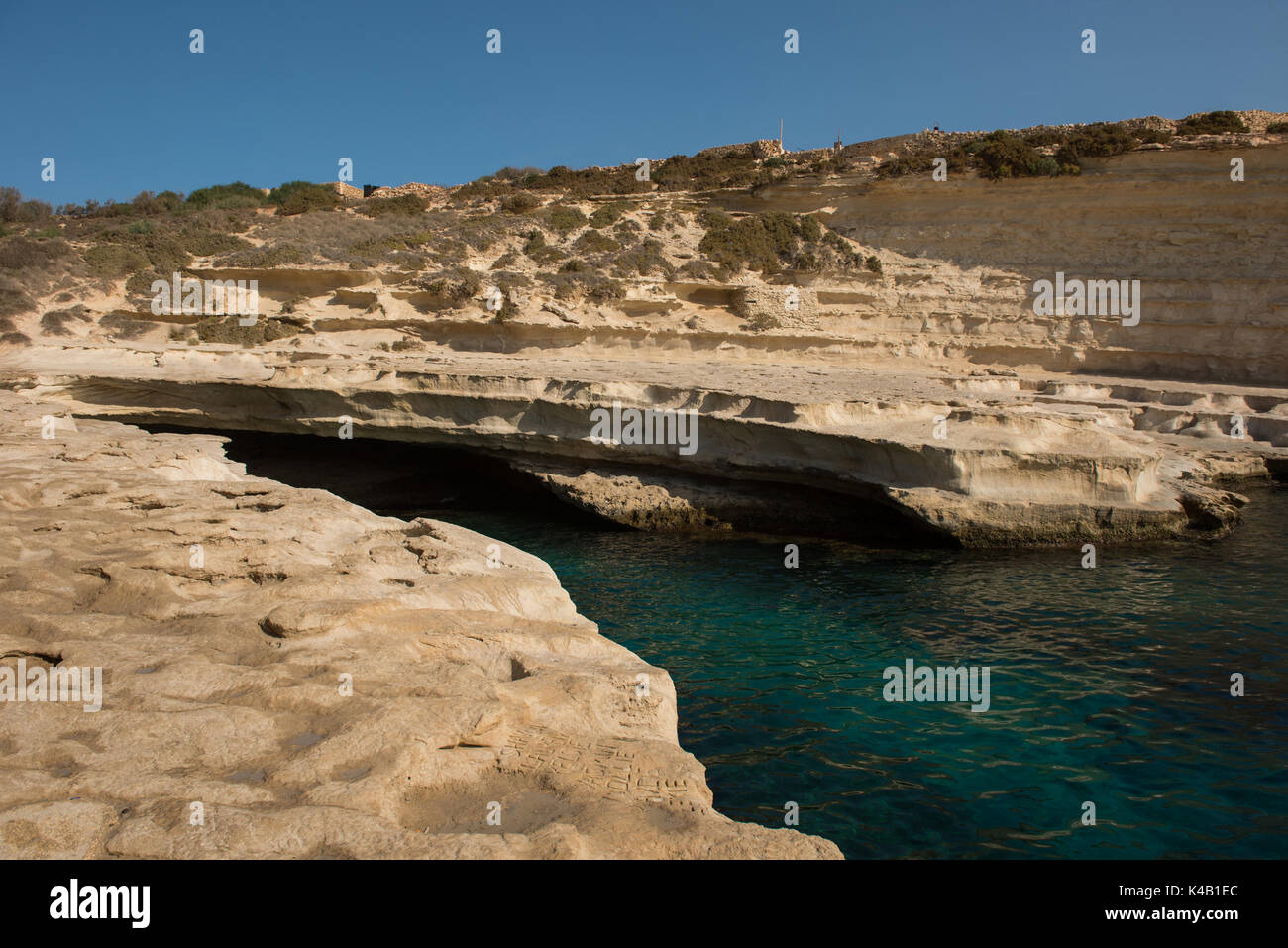 Saint Peter's pool. Rocky beach in Malta Stock Photo - Alamy
