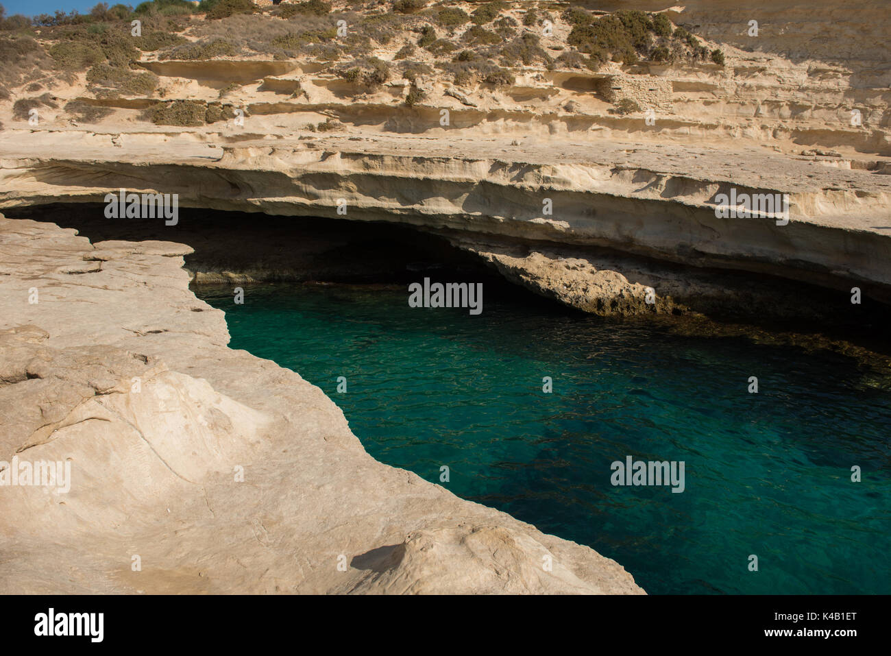 Saint Peter's pool. Rocky beach in Malta Stock Photo - Alamy