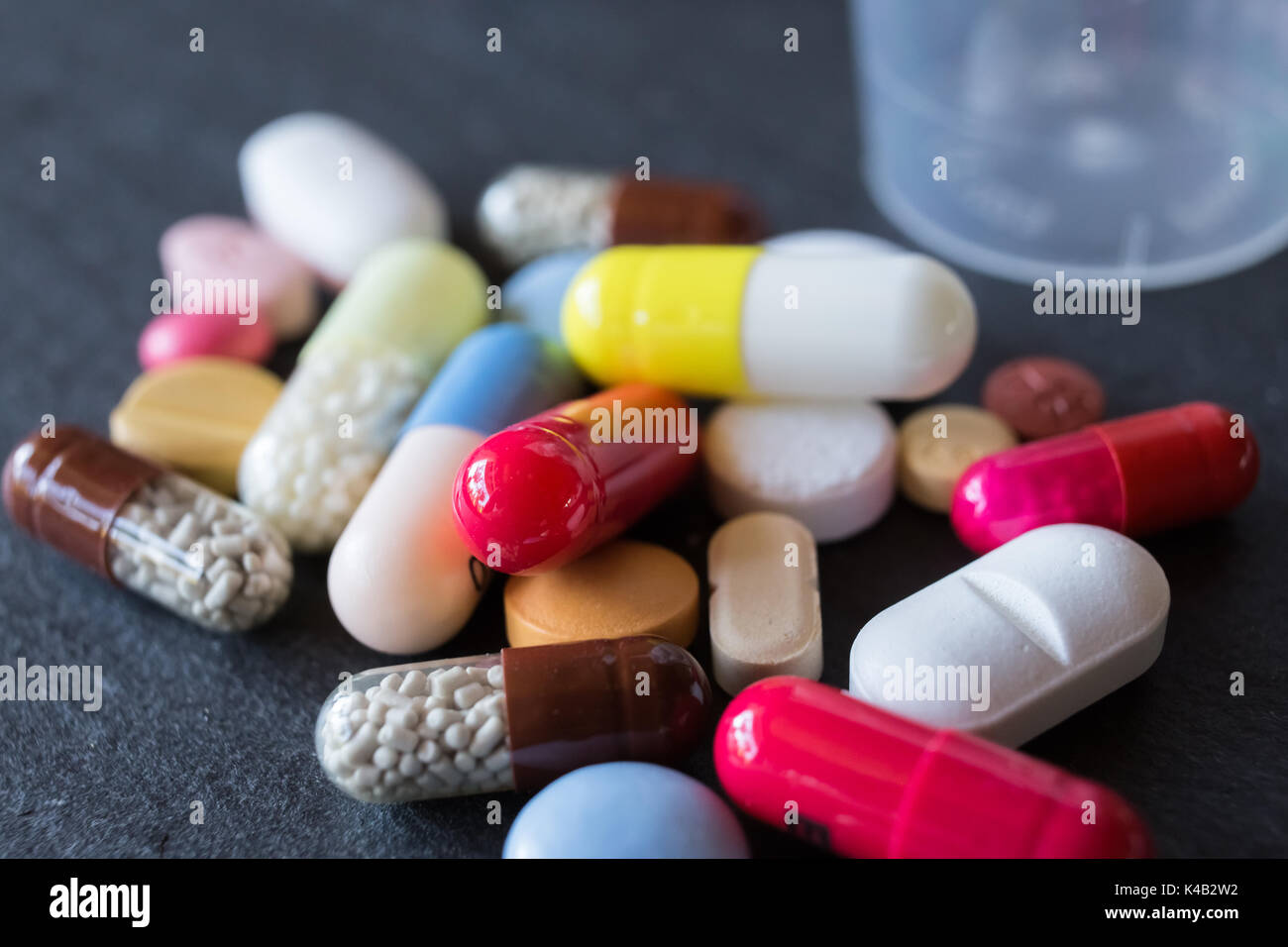 Pills In Different Shapes And Colours Stock Photo - Alamy