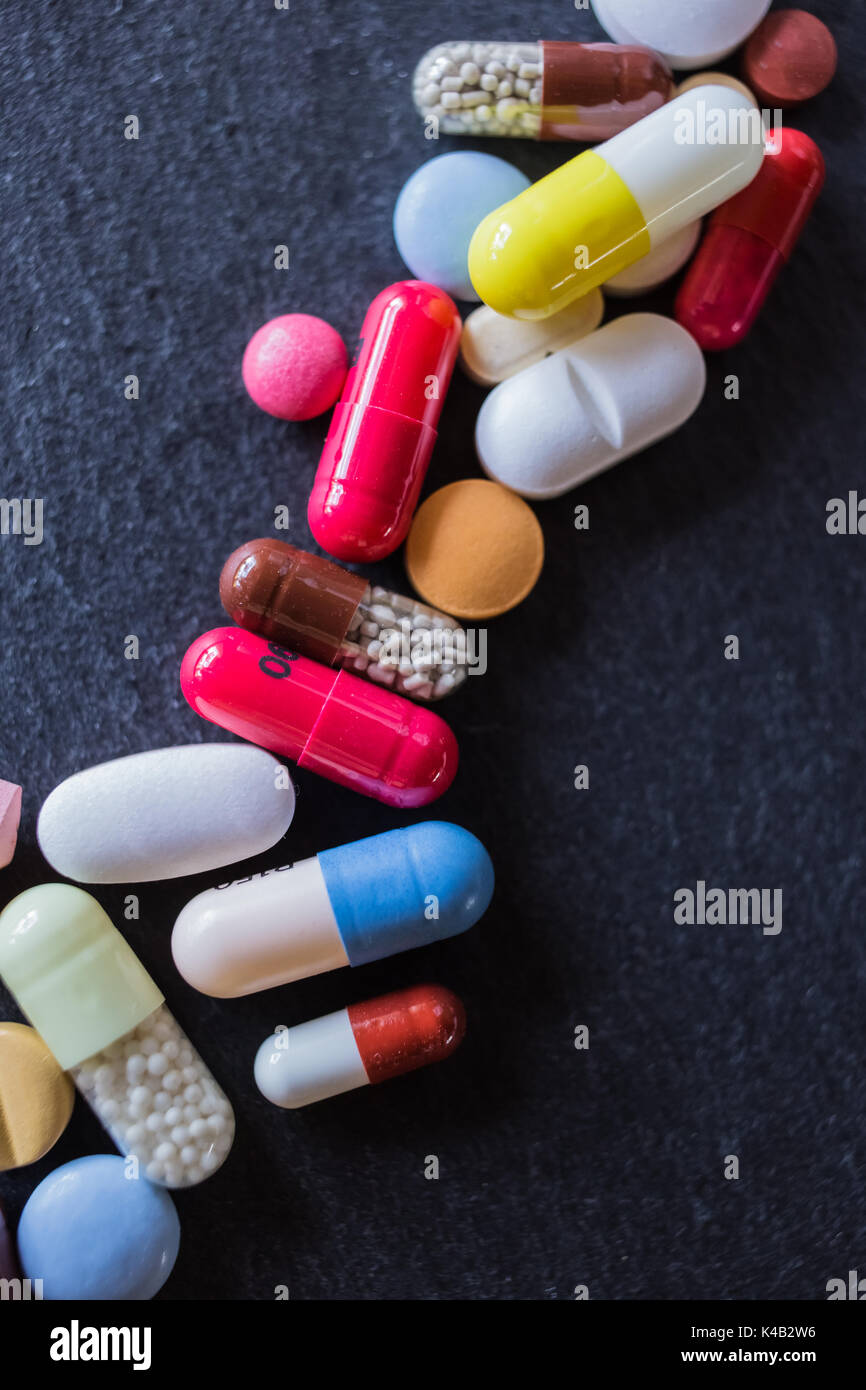 Pills In Different Shapes, Sizes And Colours Stock Photo - Alamy