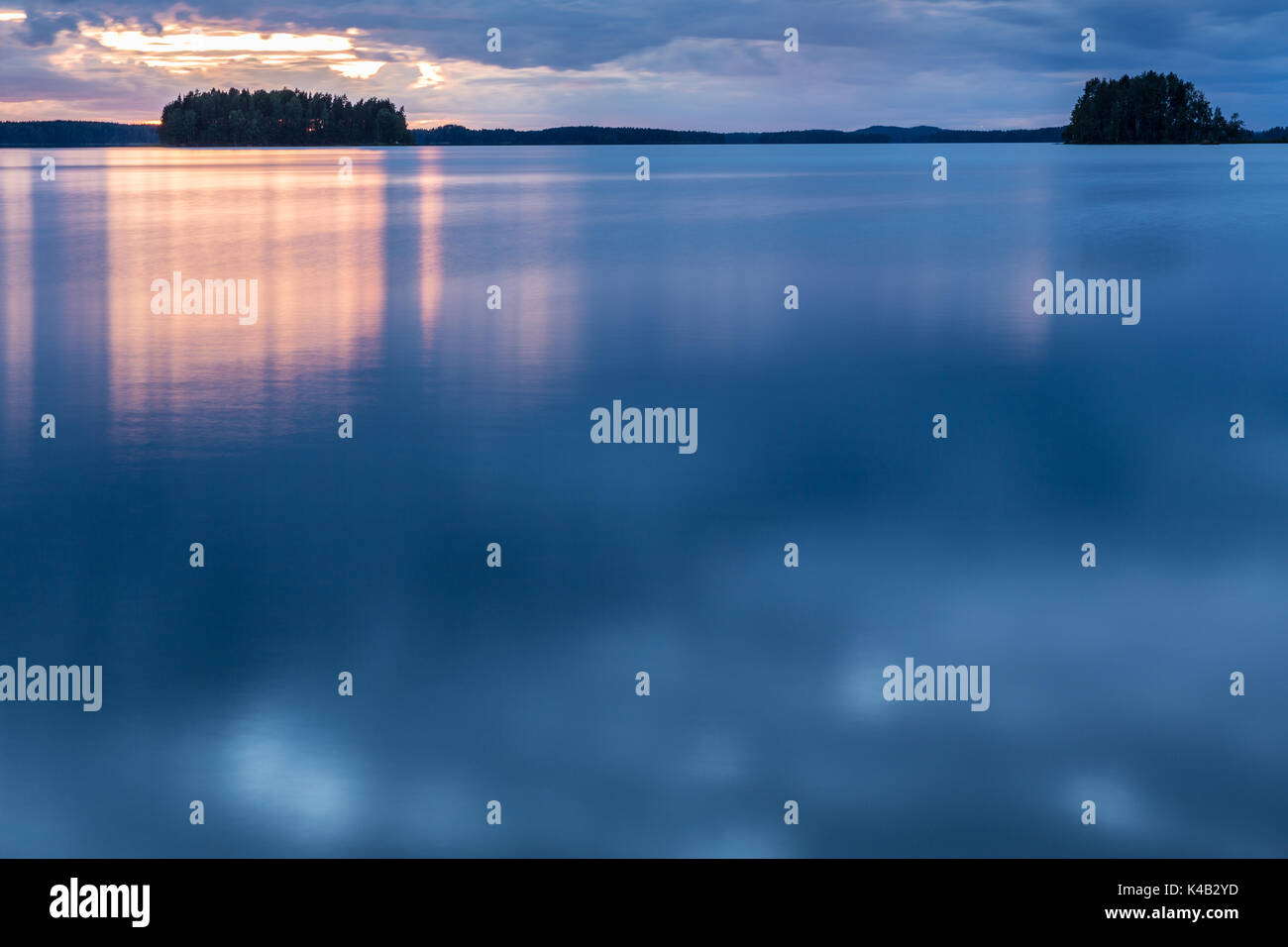 Calm Lake Surface In Scandinavia At Sunset Stock Photo - Alamy