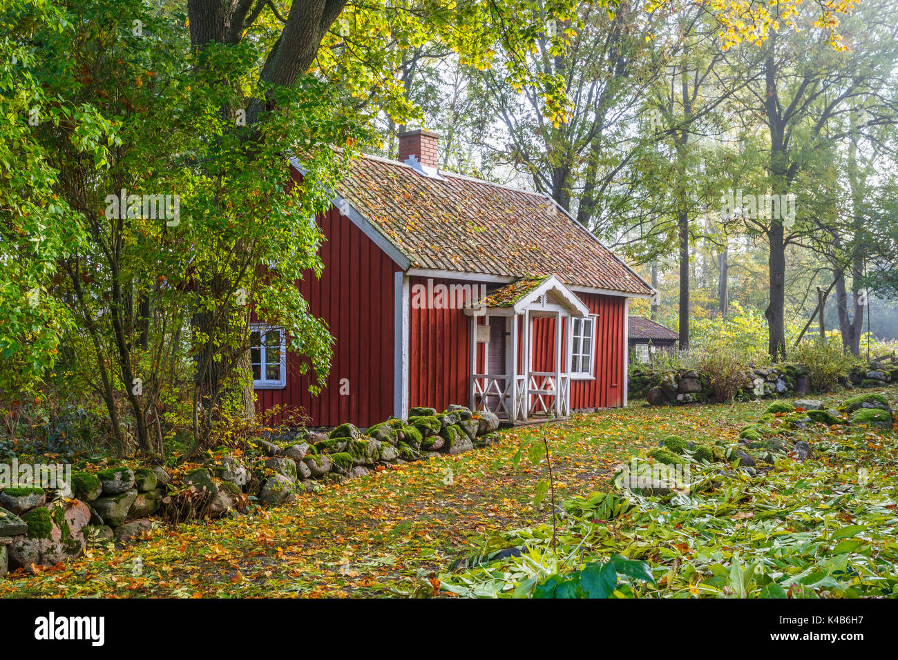 Old red cottage by a footpath Stock Photo - Alamy
