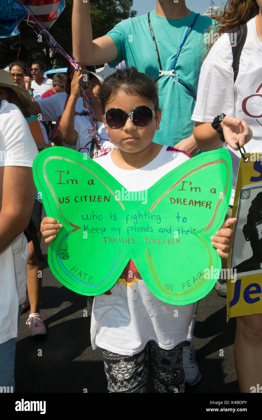 The sign reads "I'm a U.S. citizen, I'm a dreamer who is fighting to ...