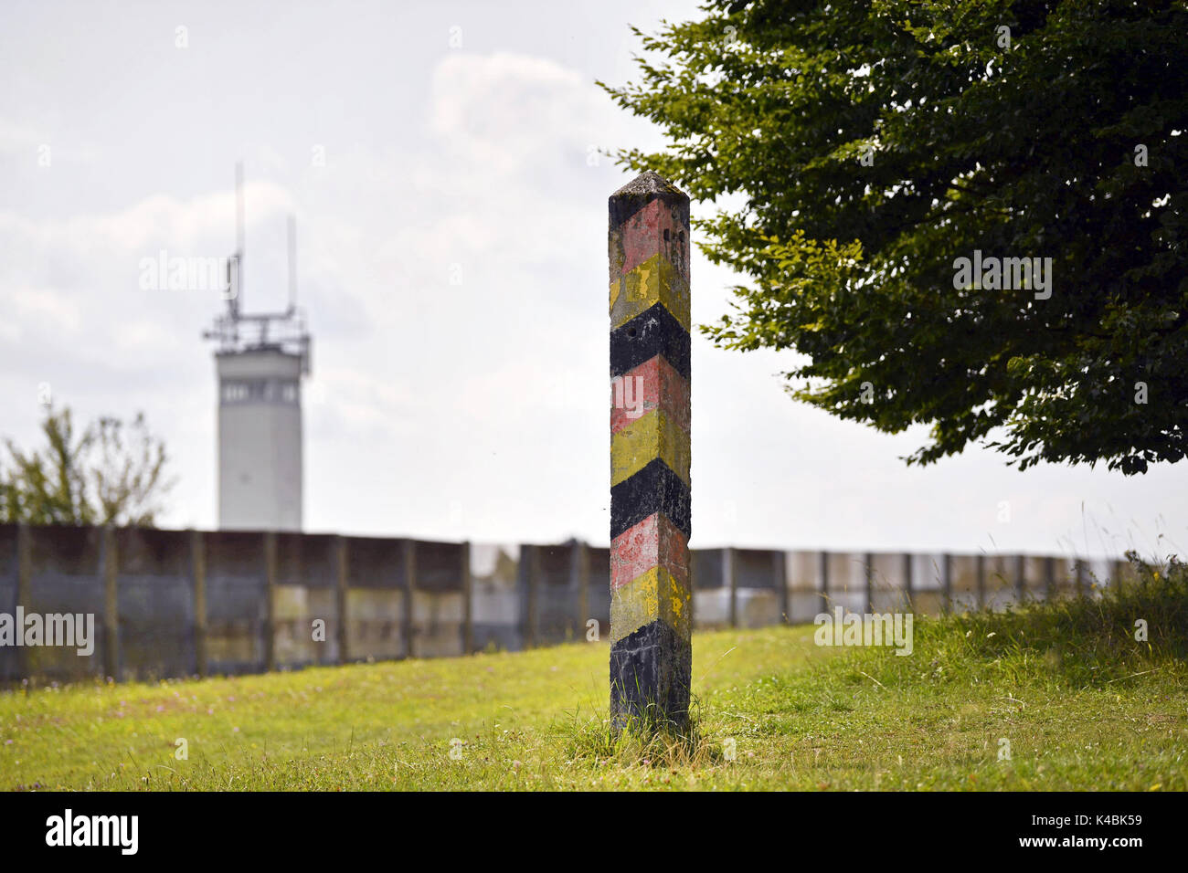 Geisa, Germany. 22nd Aug, 2017. An old boundary post and a watchtower ...