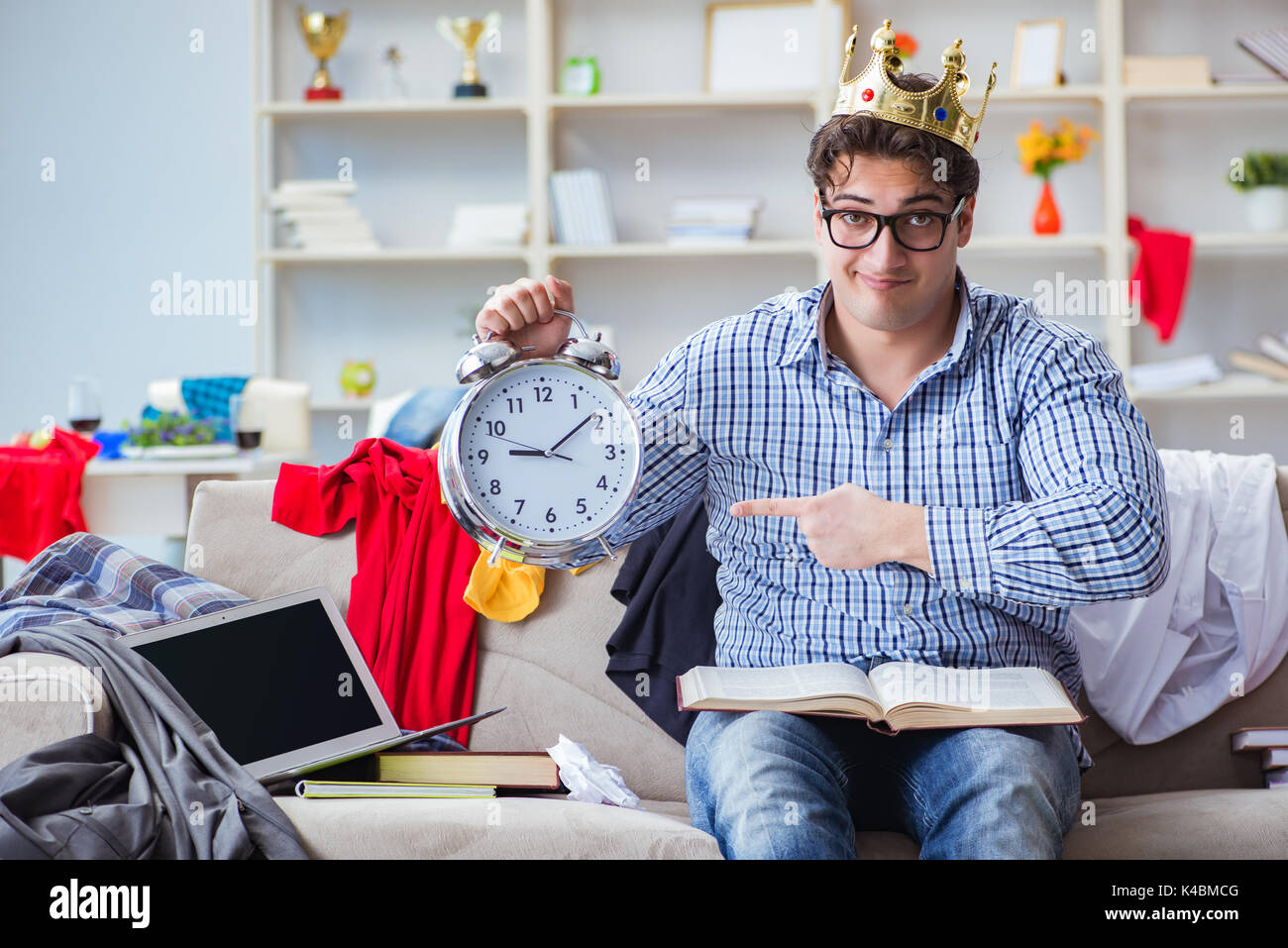 Young man working studying in messy room Stock Photo - Alamy