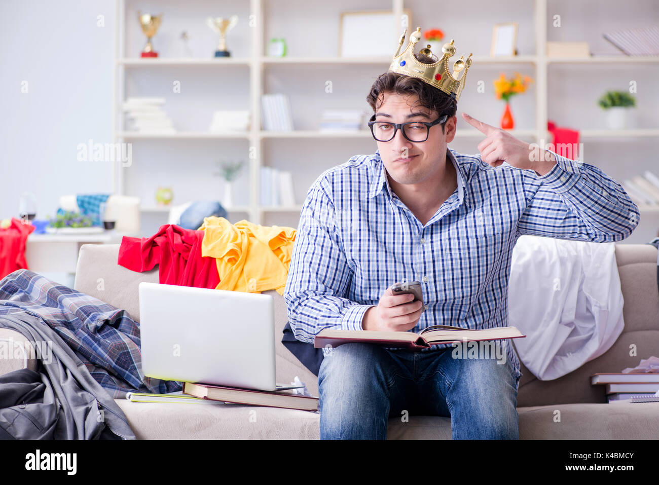 Young man working studying in messy room Stock Photo - Alamy