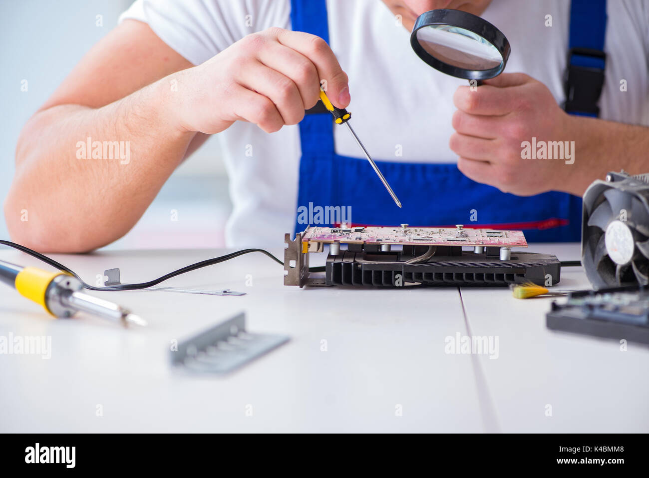 Computer repairman repairing desktop computer Stock Photo - Alamy