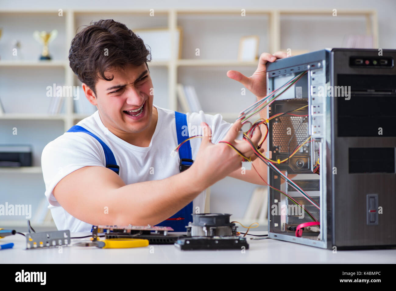 Computer repairman repairing desktop computer Stock Photo - Alamy