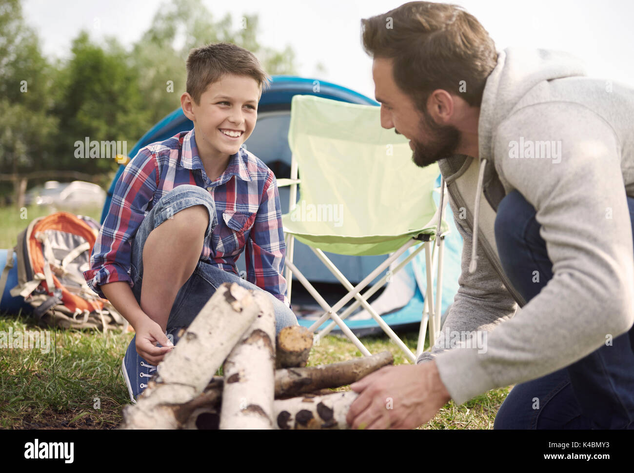 It's getting dark so we need a campfire Stock Photo - Alamy