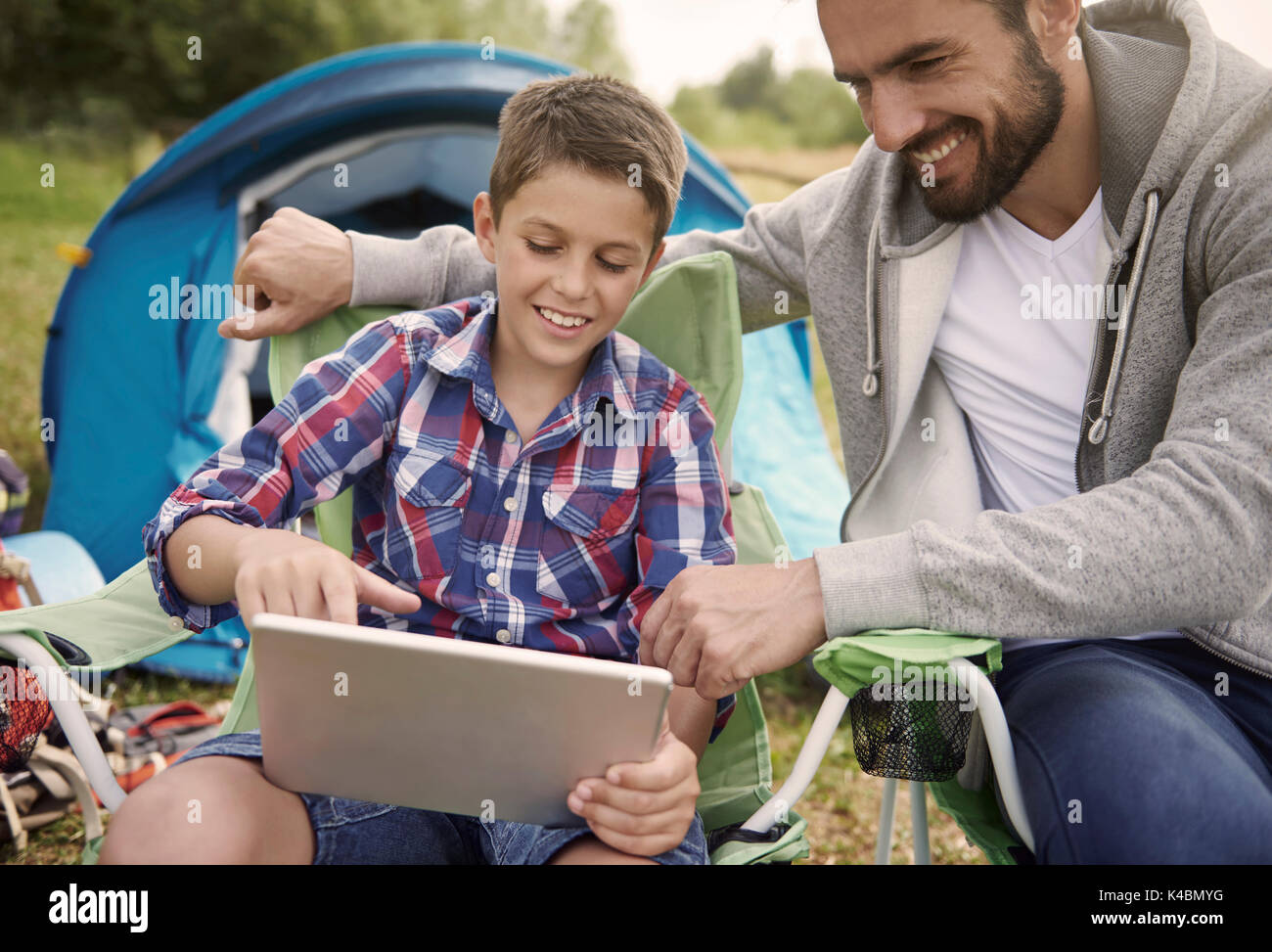 Wireless Internet is needed even on camping Stock Photo - Alamy