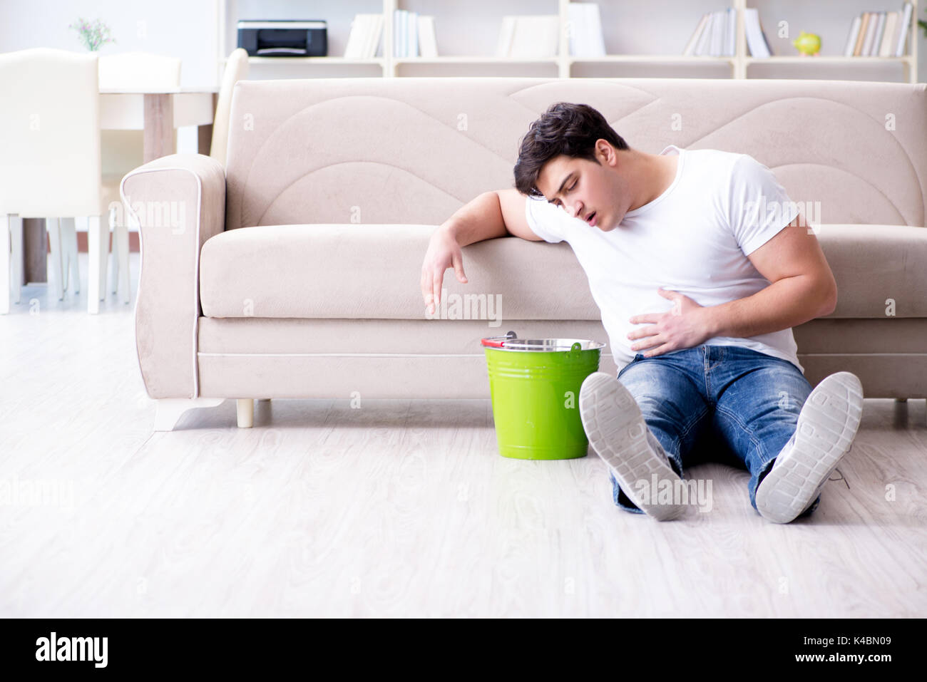 Man suffering from sick stomach and vomiting Stock Photo - Alamy