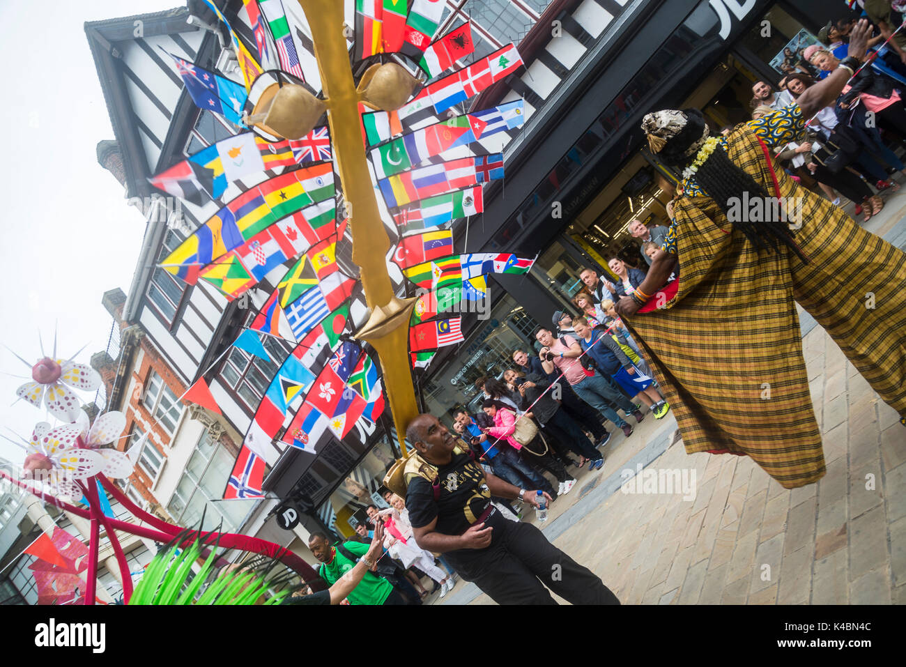 Man carrying flags from all over the world, Kingston Carnival, Kingston ...