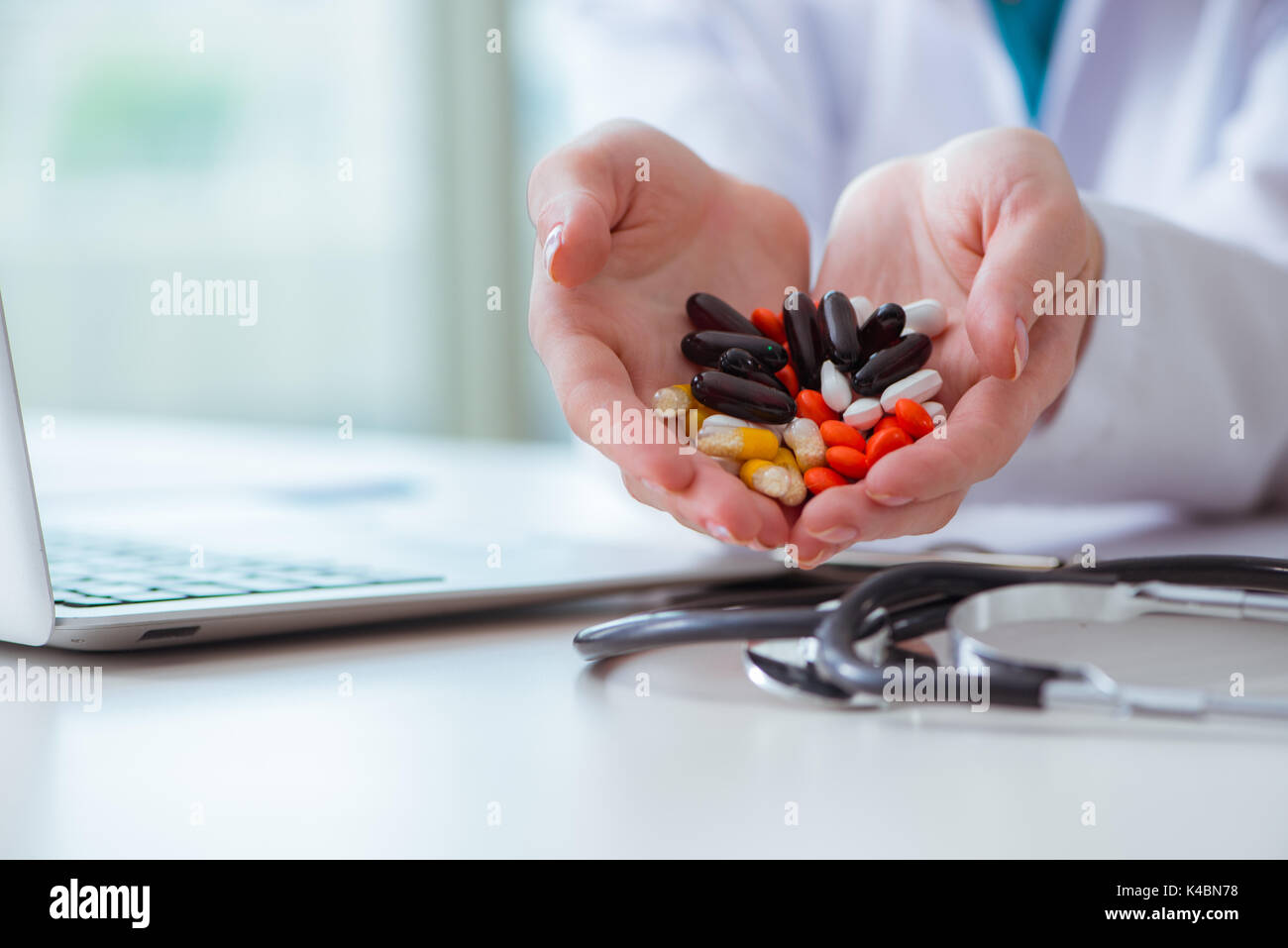 Medical concept with medicines and laptop computer Stock Photo - Alamy