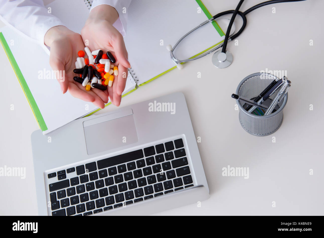 Medical concept with medicines and laptop computer Stock Photo - Alamy