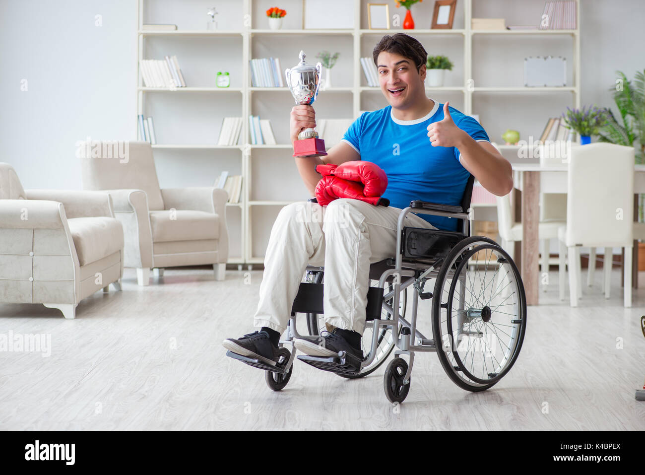 Disabled boxer at wheelchair recovering from injury Stock Photo - Alamy