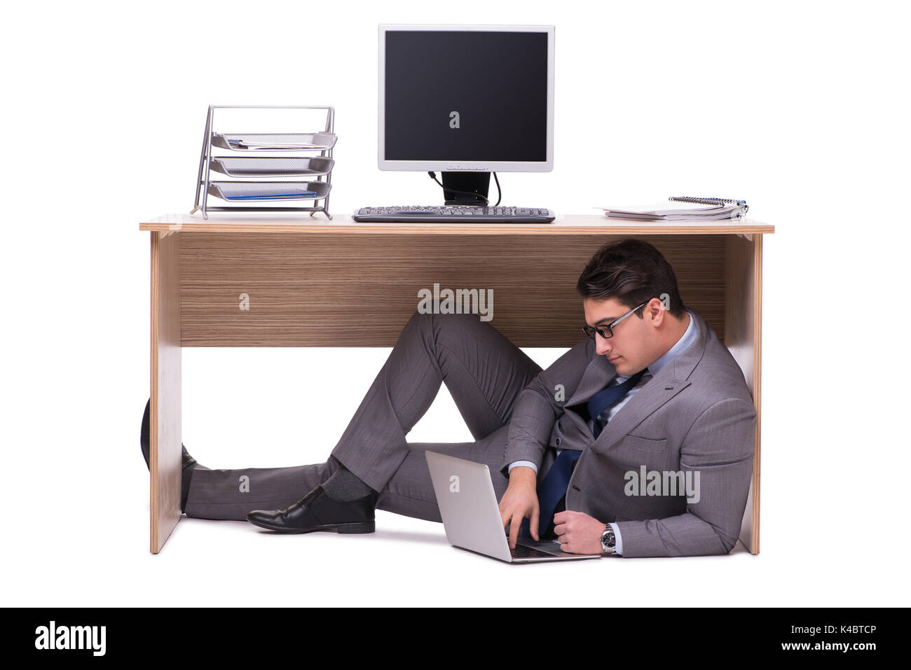 Businessman hiding in the ofice Stock Photo - Alamy