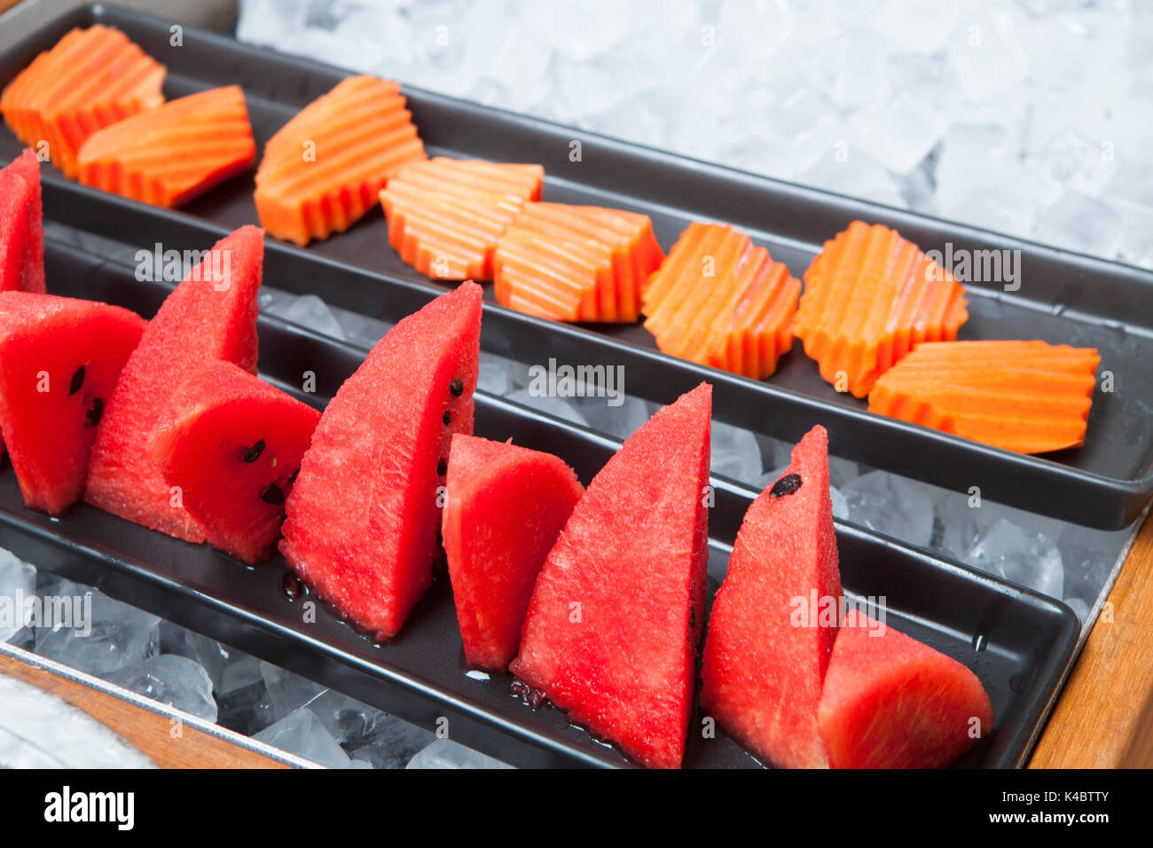 Watermelon, papaya and put on a container ready for breakfast Stock ...